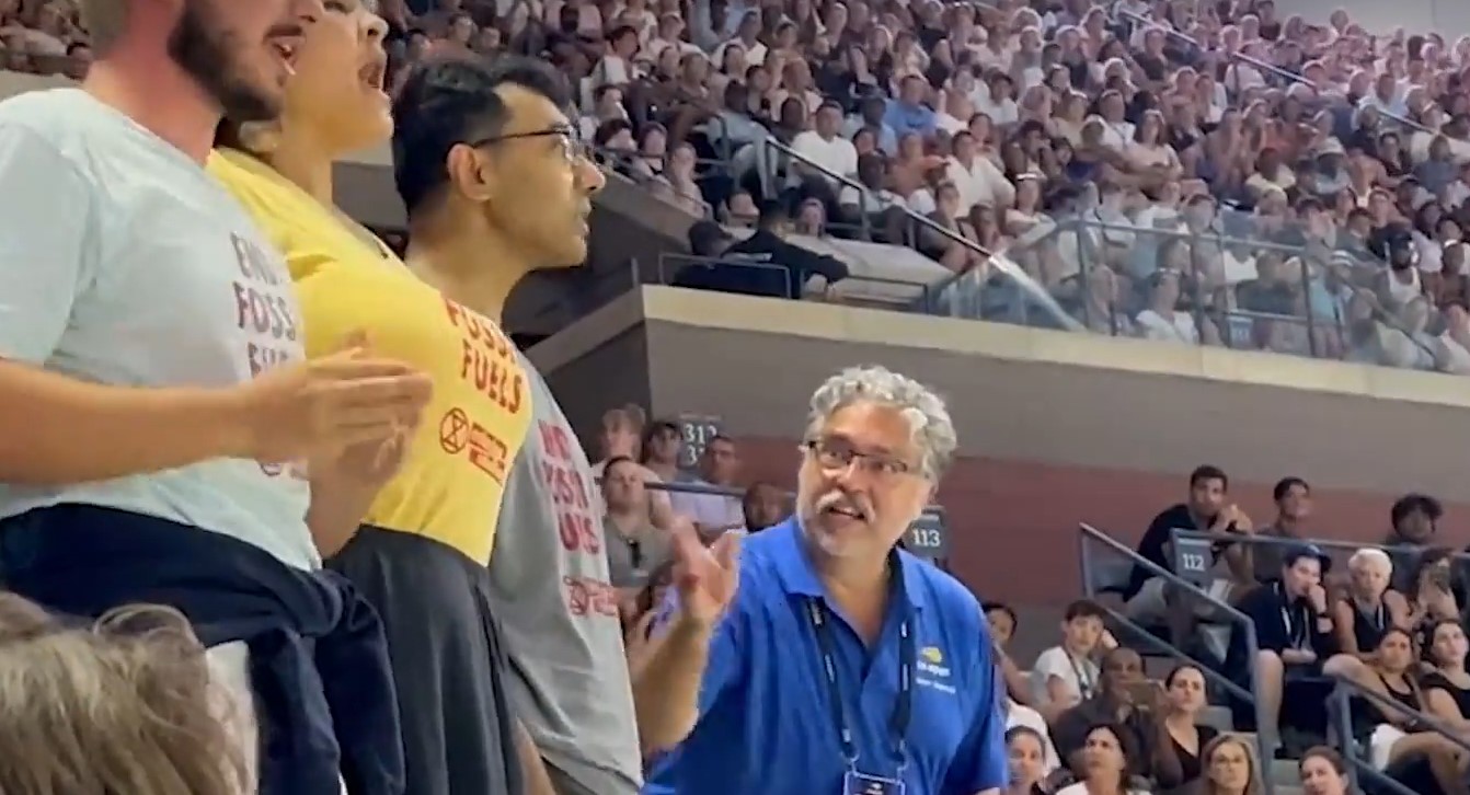 Indian-American man glues feet to stadium floor in climate protest at ...